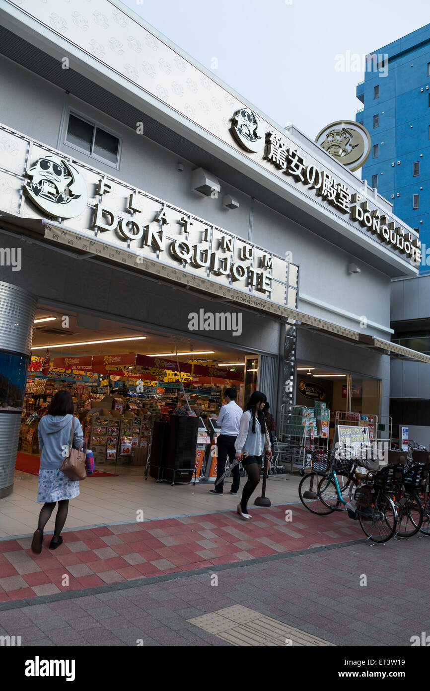 Customers buy products at the new ''Platinum Don Quijote'' store in ...