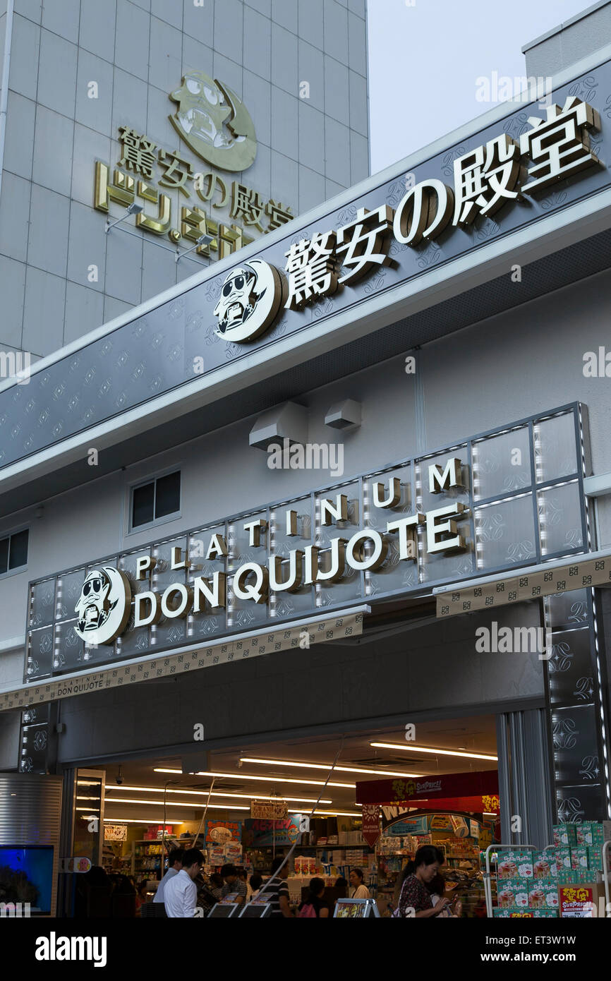 Signs stand on display above the new Platinum Don Quijote store in ...
