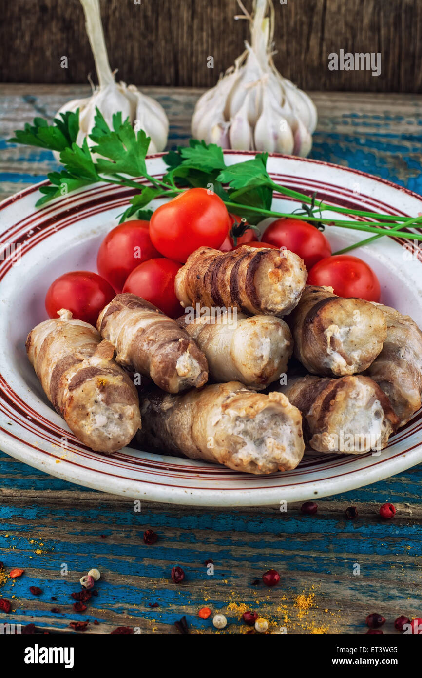 cooked meat products with spices and tomatoes Stock Photo - Alamy