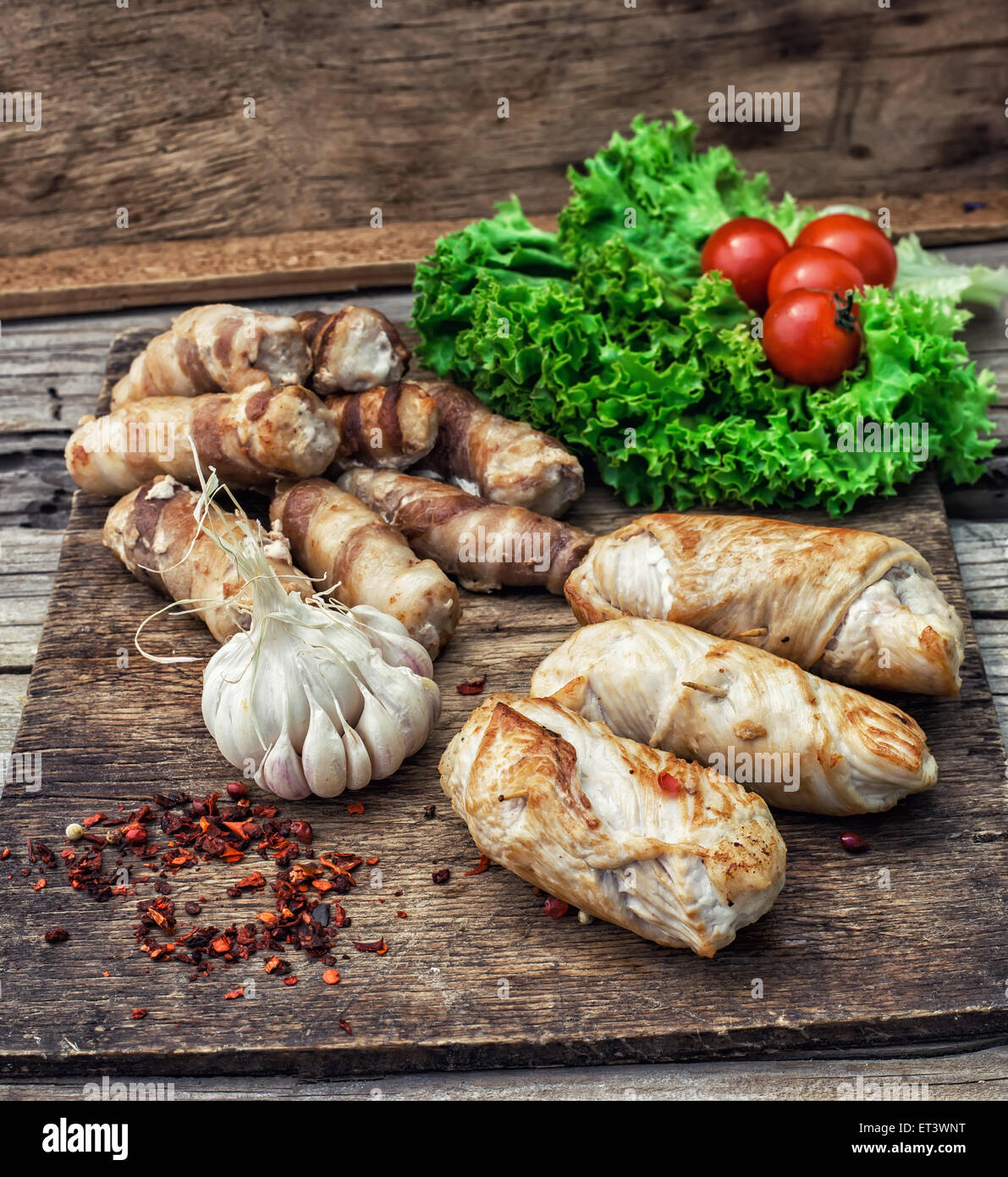 cooked meat products with spices and tomatoes Stock Photo - Alamy