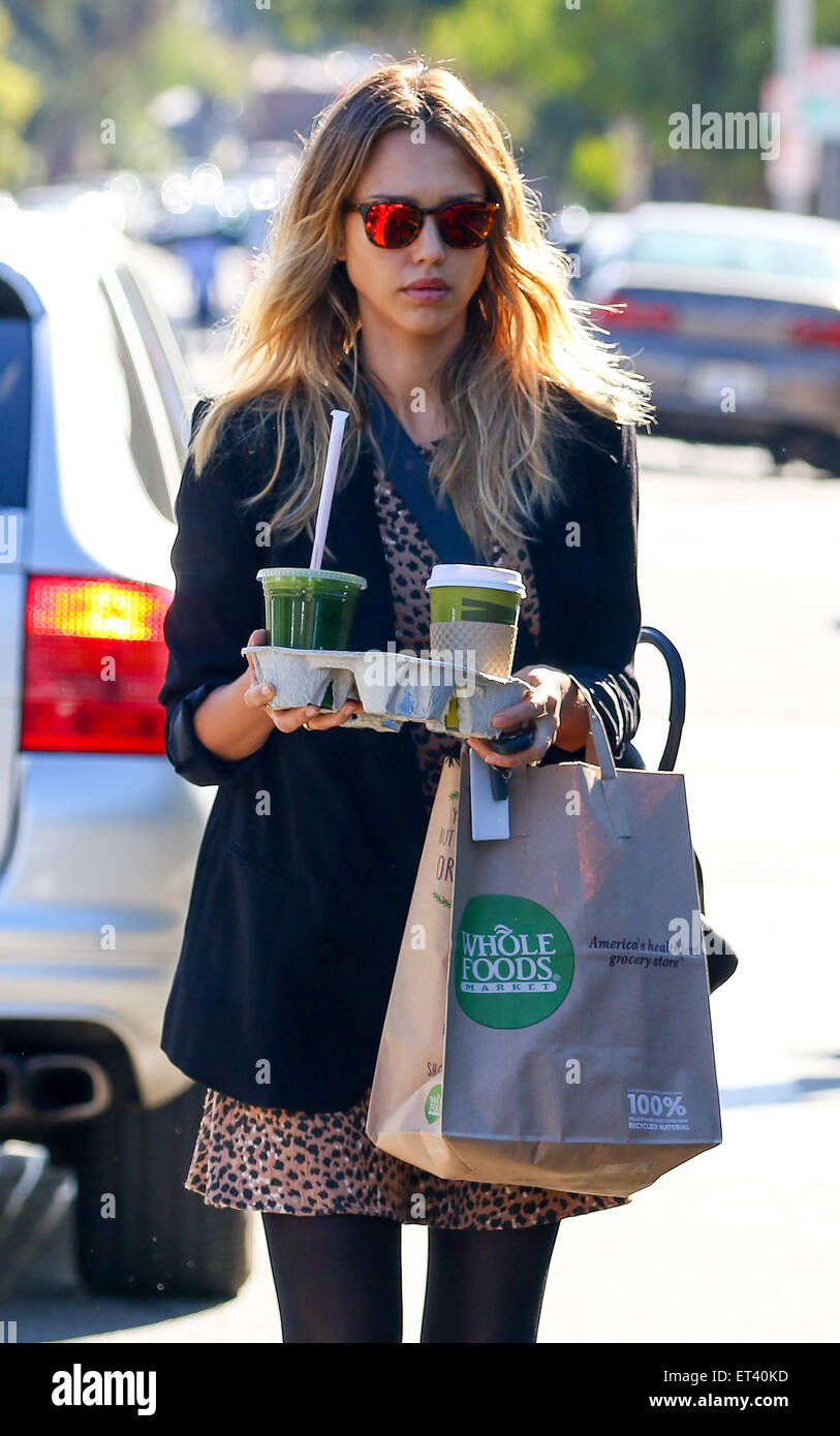Jessica Alba leaves Whole Foods Market with a hot beverage and a green ...