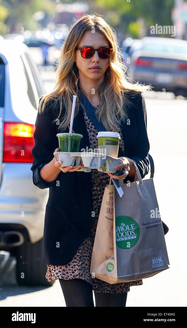 Jessica Alba leaves Whole Foods Market with a hot beverage and a green ...
