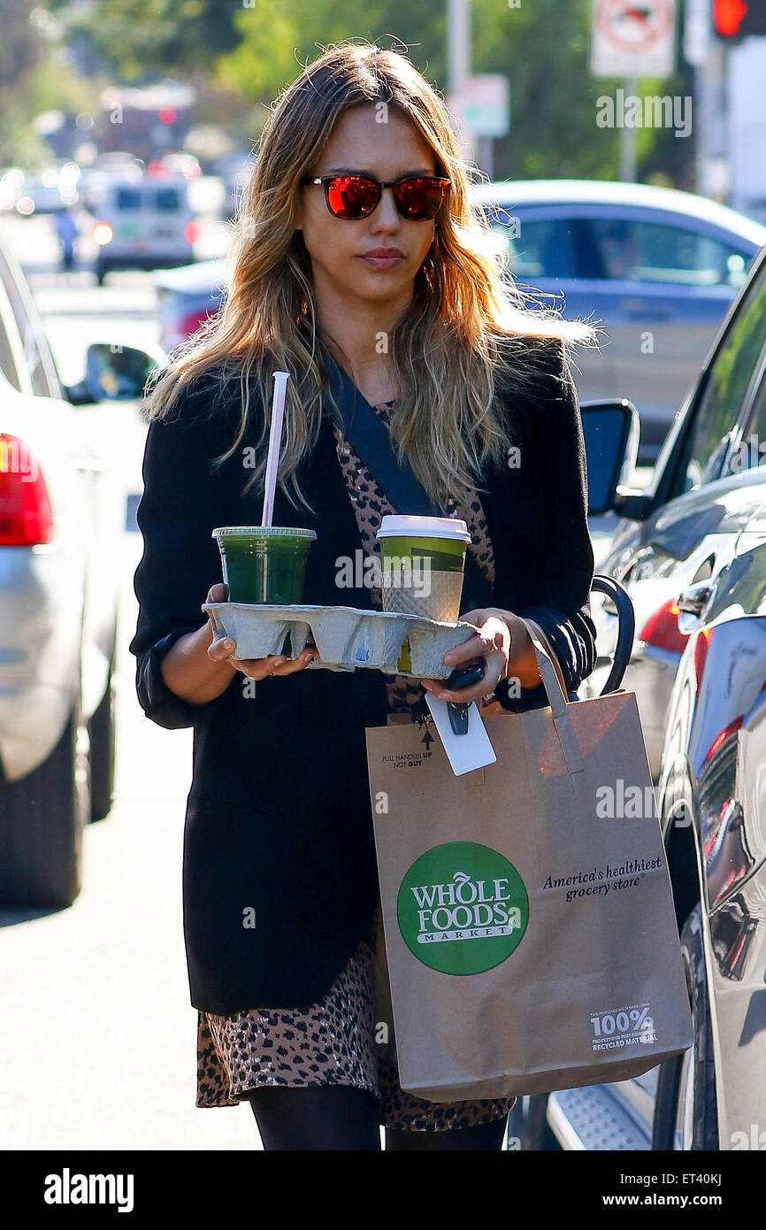 Jessica Alba leaves Whole Foods Market with a hot beverage and a green ...