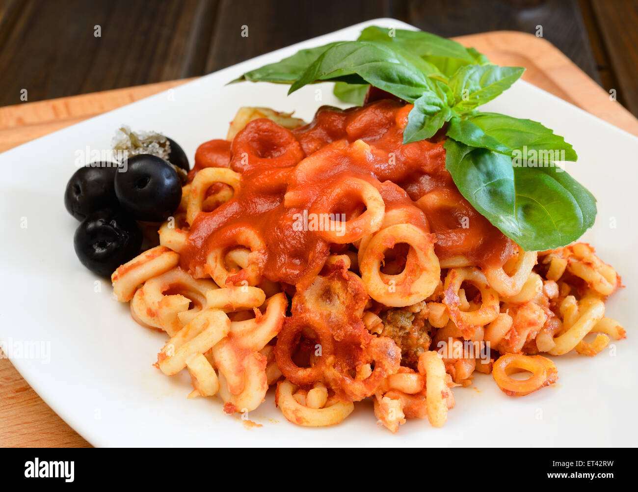 small rings of Sicilian pasta with olive and capers tomatoes Stock ...