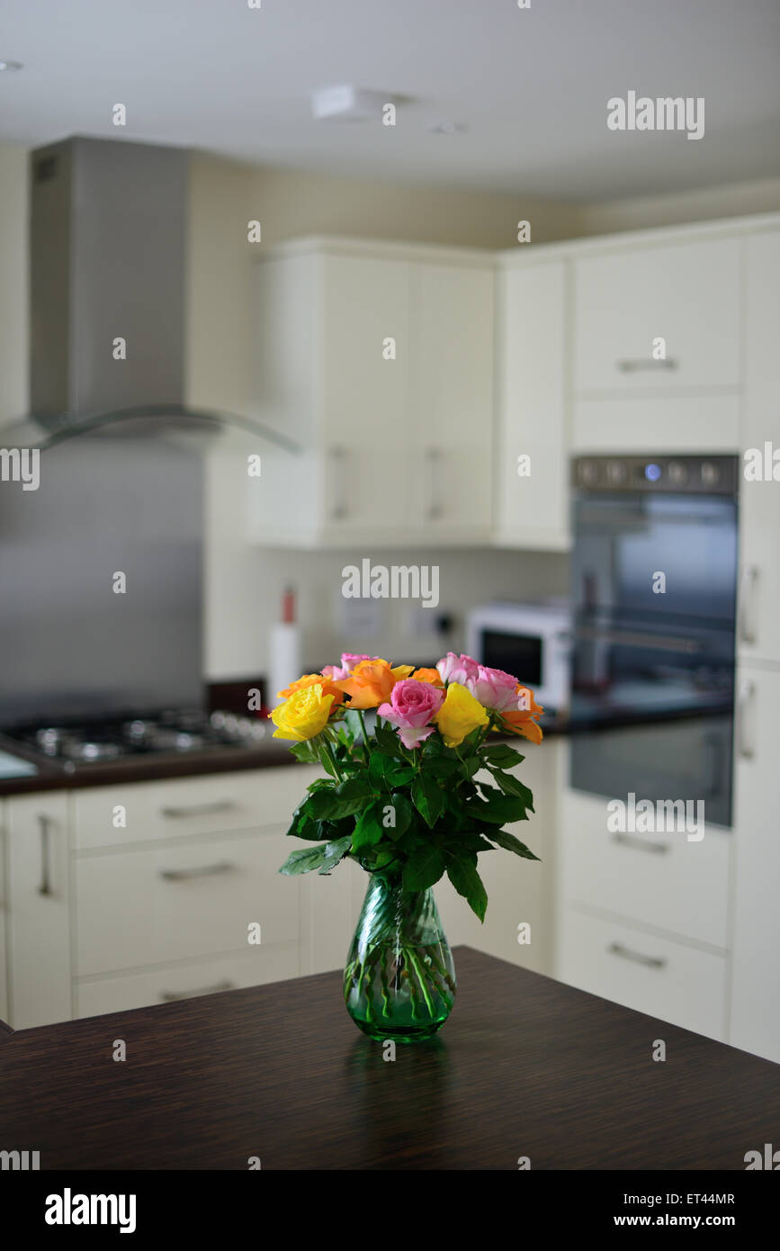 Roses on a kitchen worktop Stock Photo - Alamy