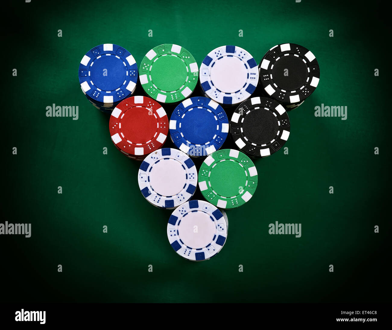 Color stacks of poker chips on green table Stock Photo - Alamy