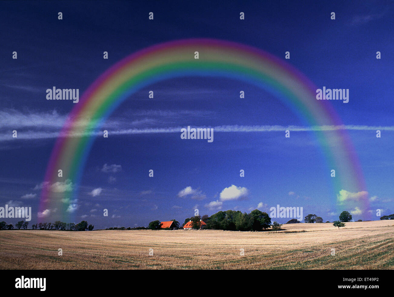 Hamburg, Germany, rainbow in the sky over field Stock Photo - Alamy