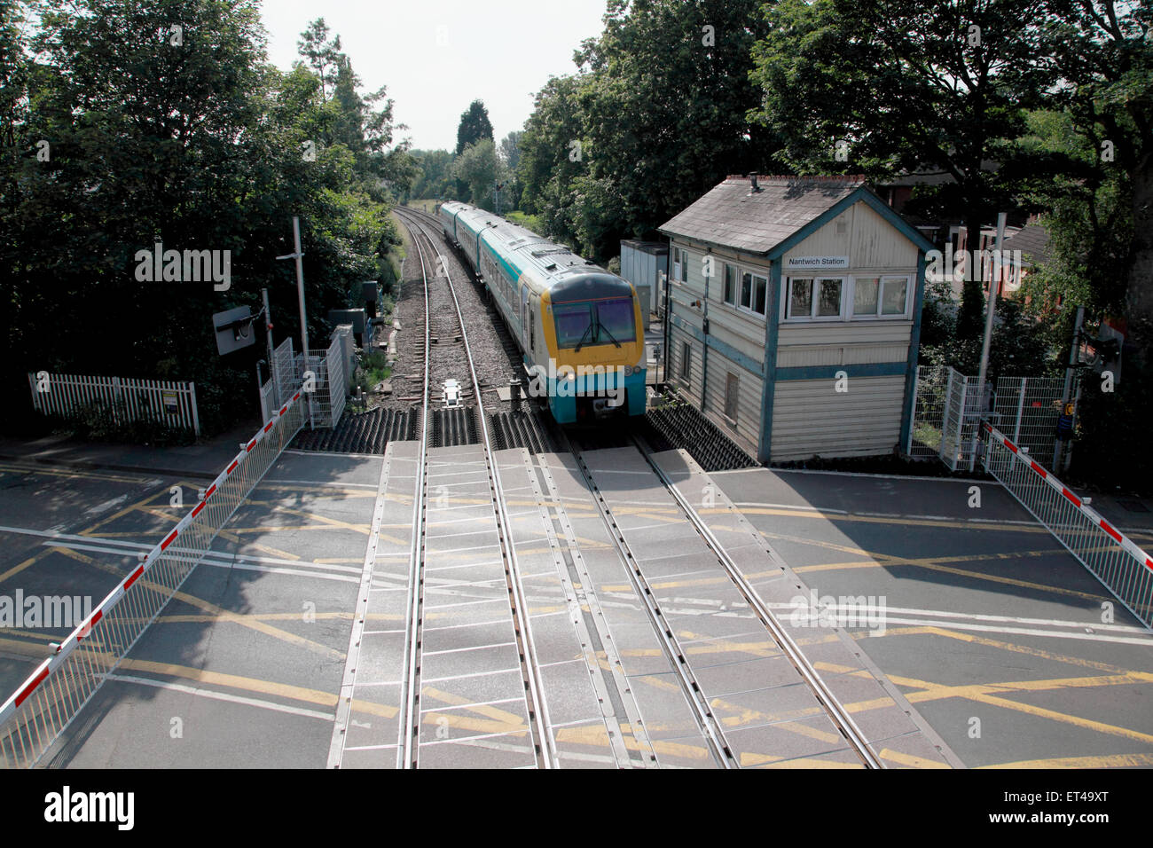 The level crossing and signal box by the railway station in Nantwich ...