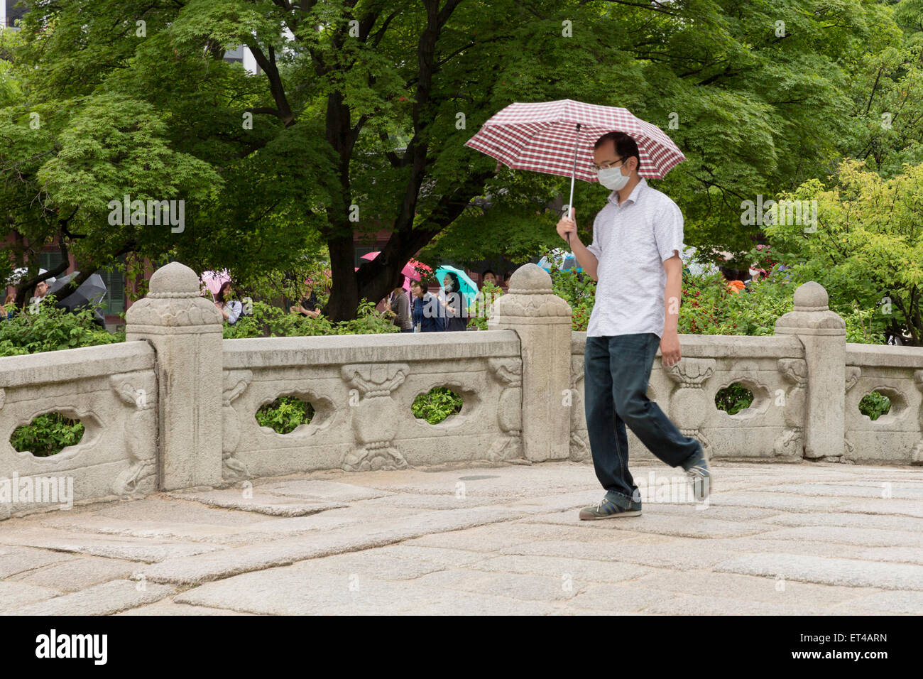 Tourists, wearing face masks as a precaution against the MERS, Middle ...