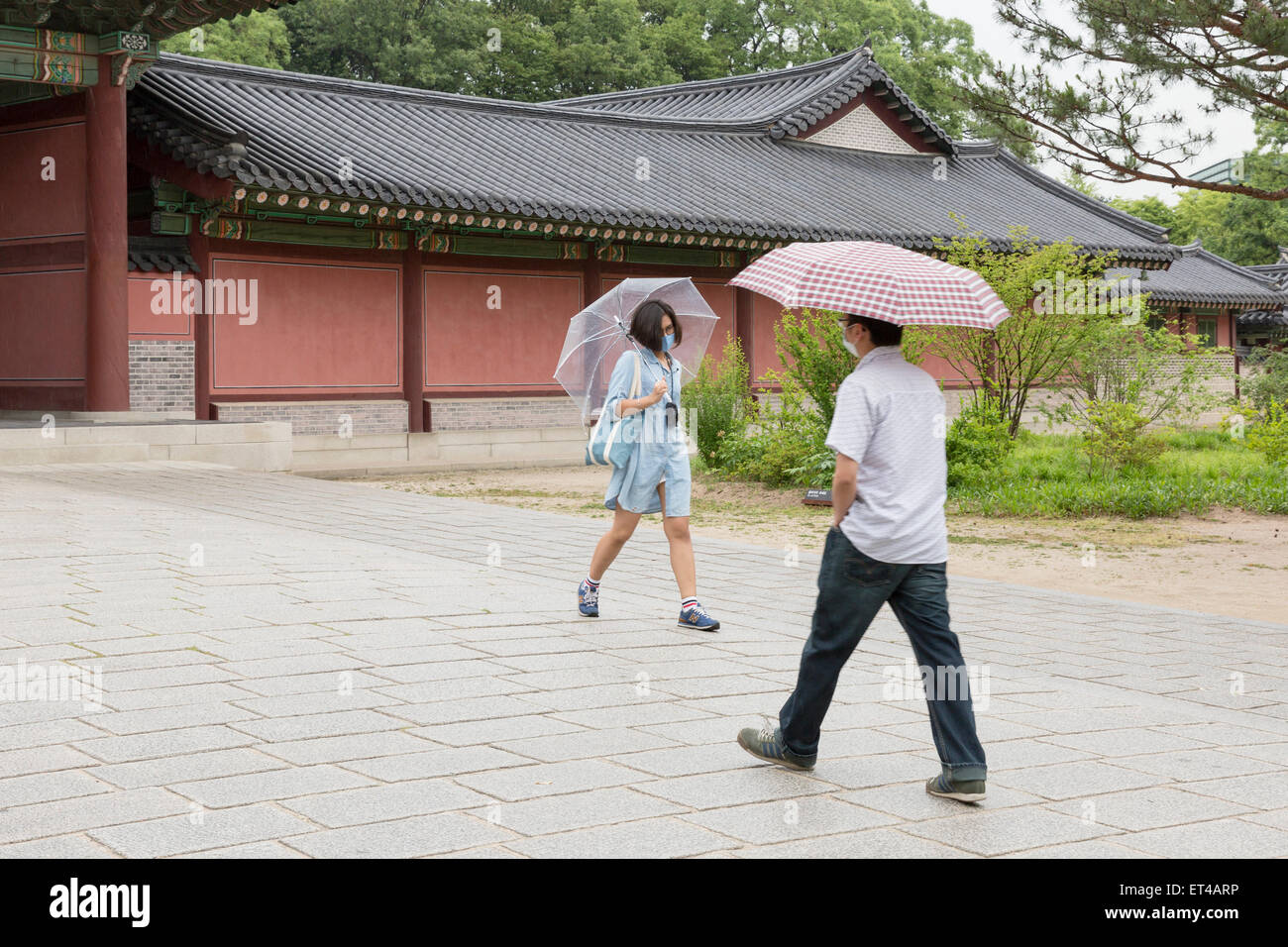 Tourists, wearing face masks as a precaution against the MERS, Middle ...