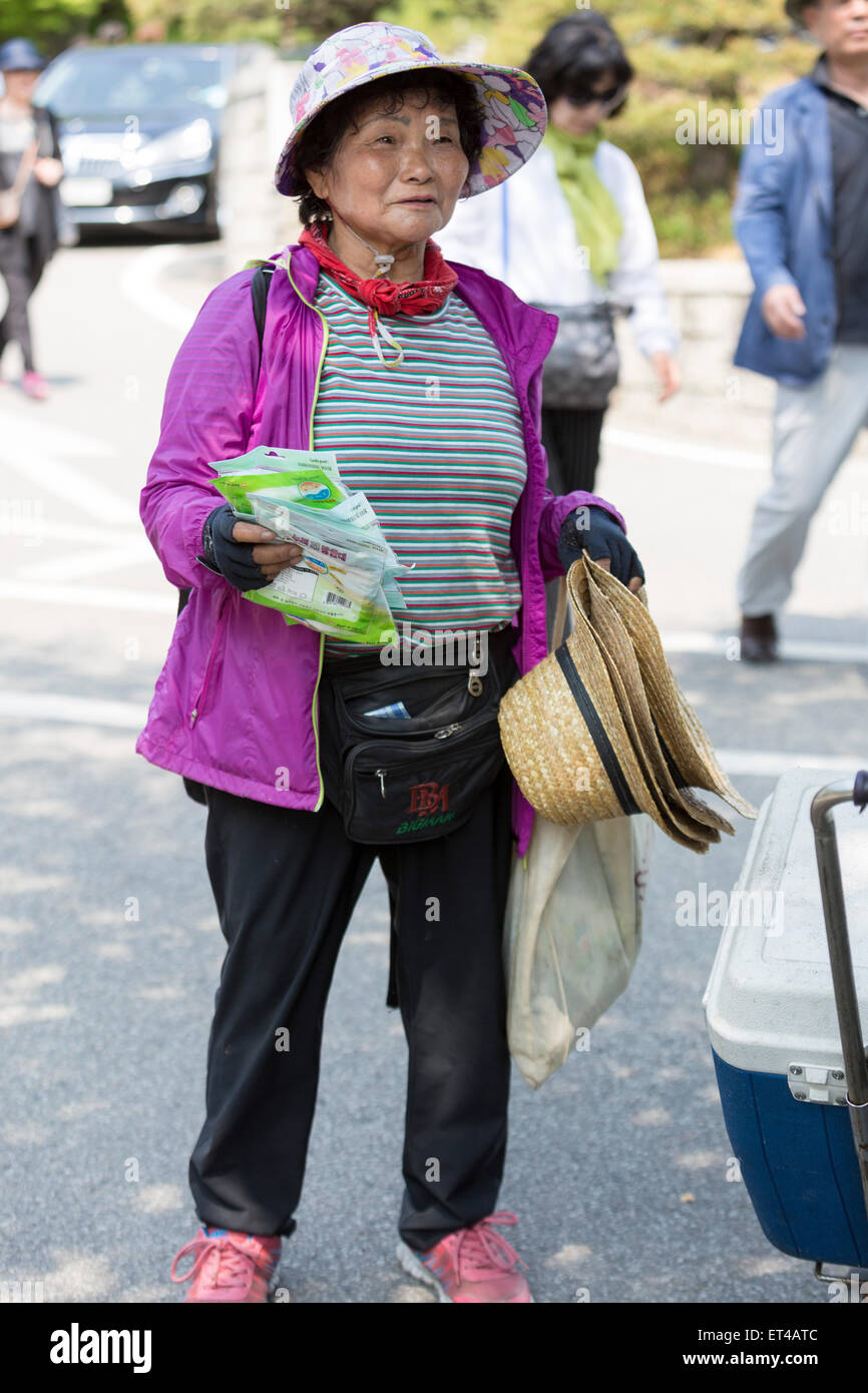 Woman selling masks as a precaution against MERS virus during the ...