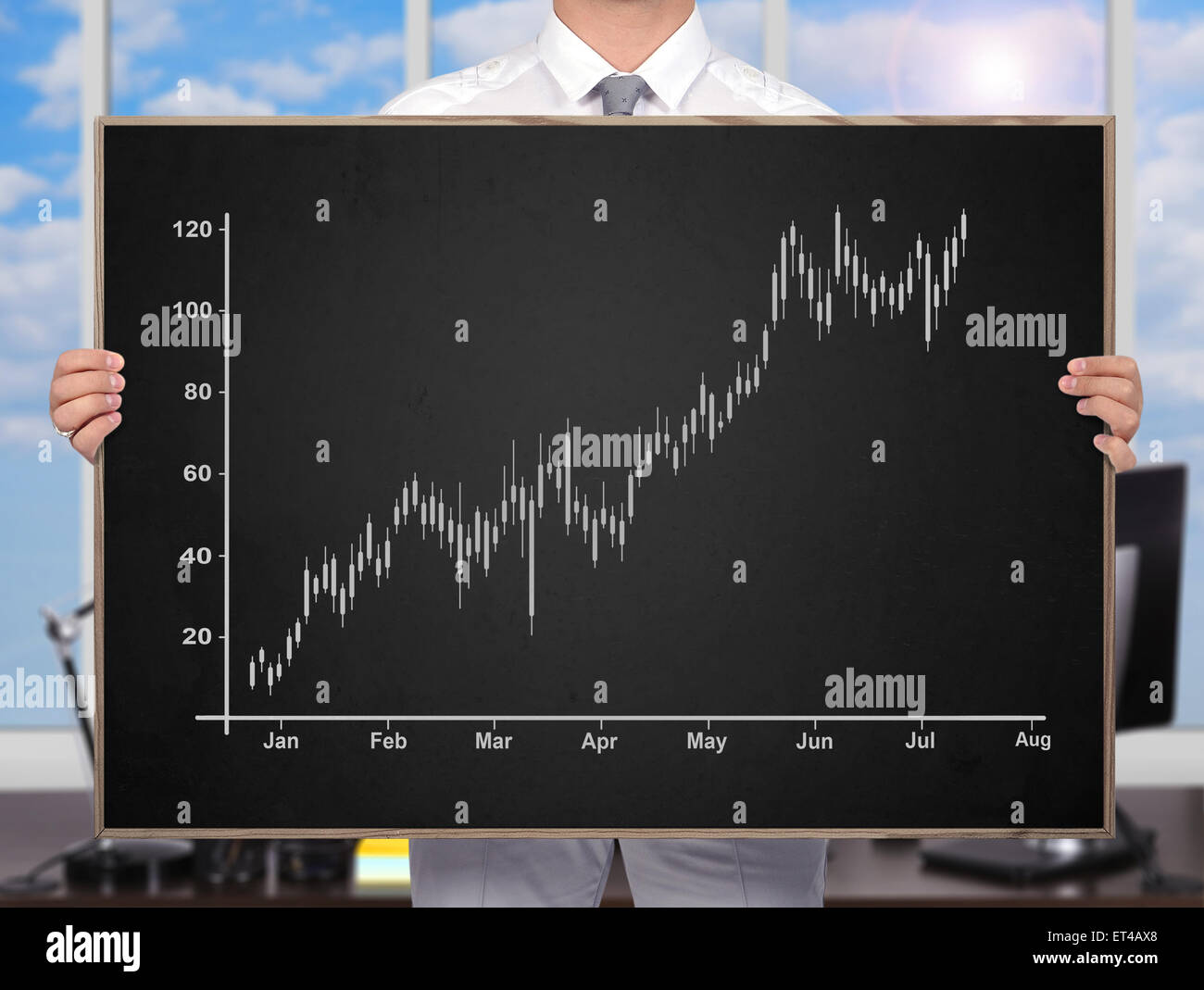 businessman holding chalk board with drawing stock chart Stock Photo ...