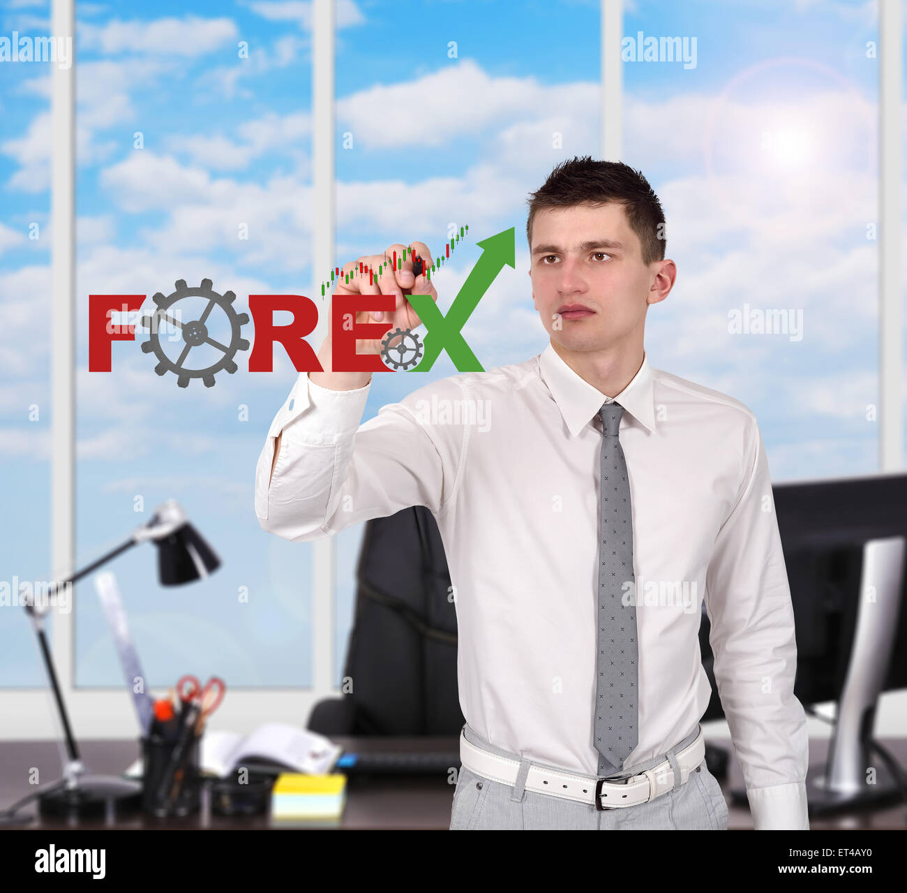young businessman in office drawing forex symbol Stock Photo - Alamy