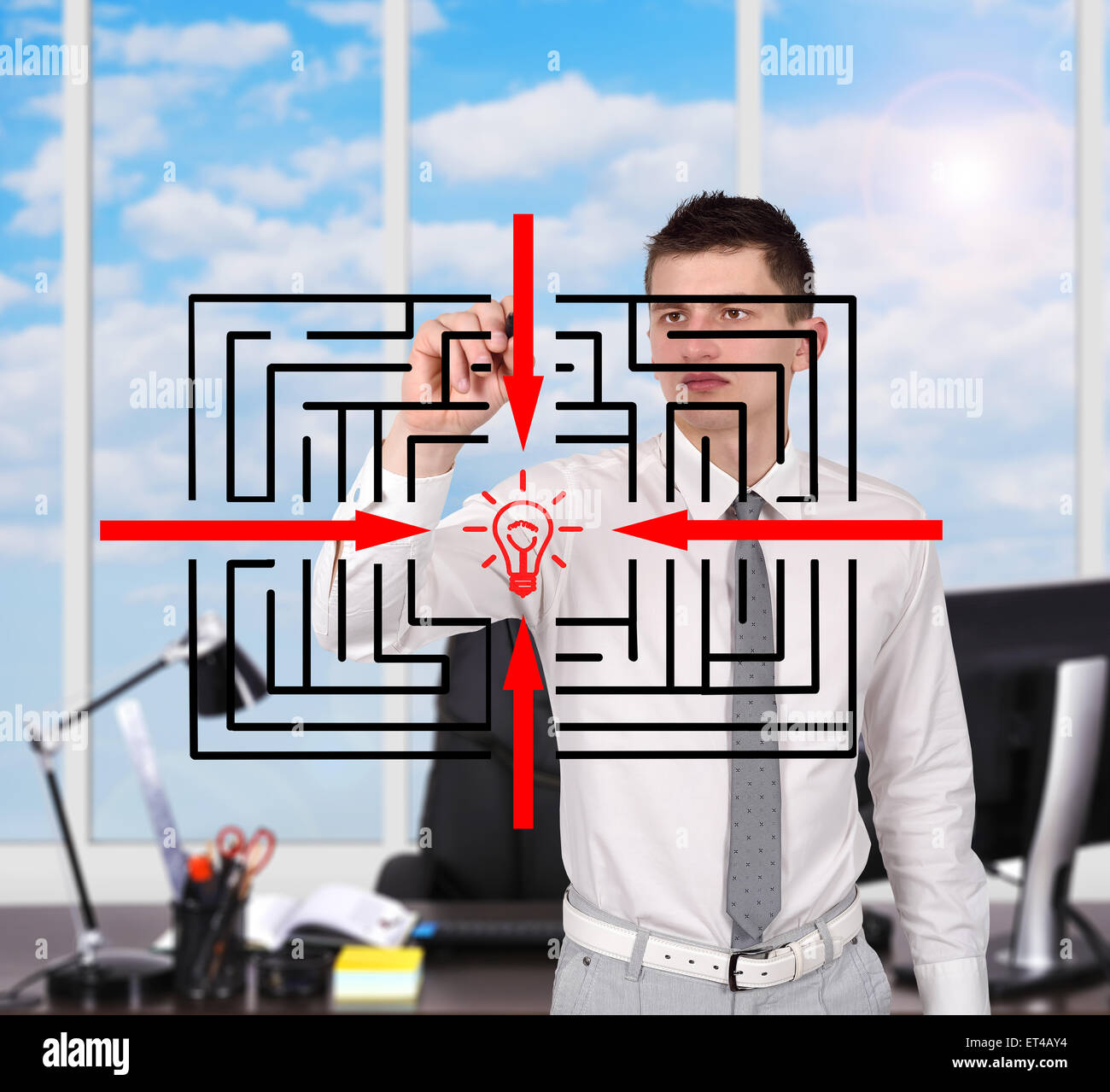 young businessman in office drawing labyrinth Stock Photo - Alamy