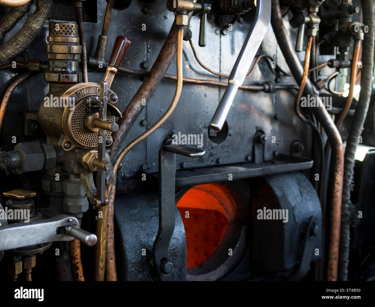 controls of a vintage steam locomotive at Loughborough station, on the ...