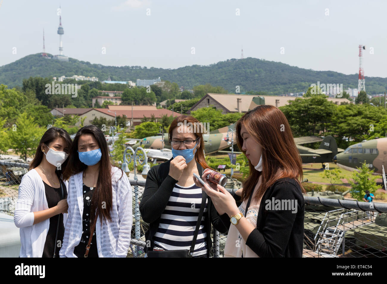 Tourists, wearing face masks as a precaution against the MERS, Middle ...