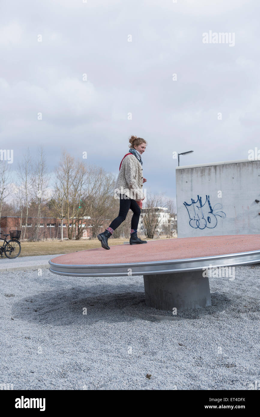 Young woman running on roundabout Munich Bavaria Germany Stock Photo ...