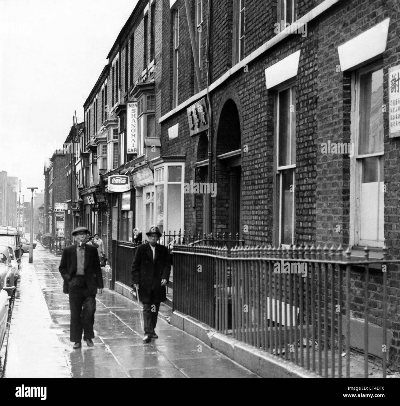 Two chinese men walking down Nelson Street in Chinatown, Liverpool ...