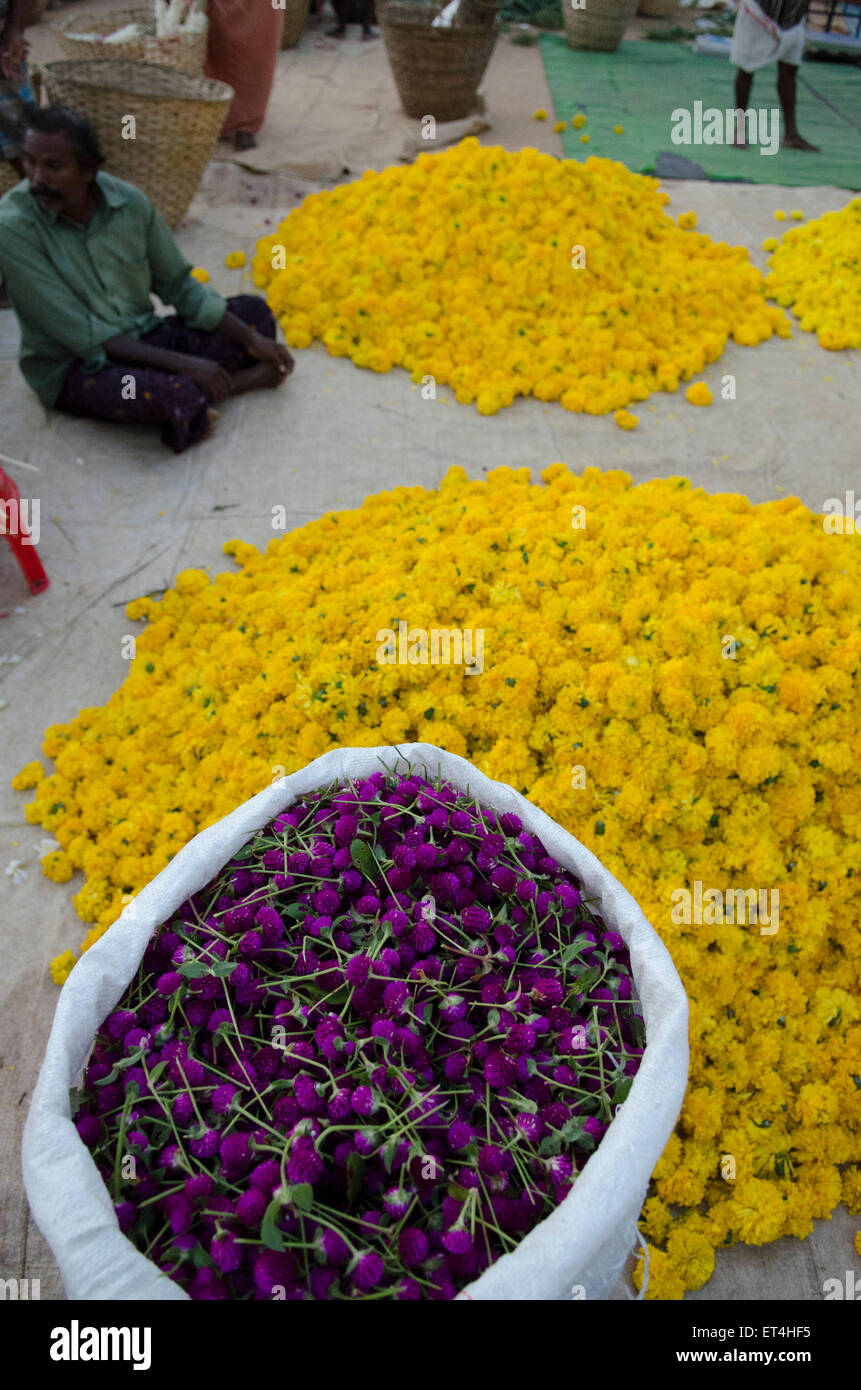 flowers are piled high for sale at Thovalai flower market Stock Photo ...