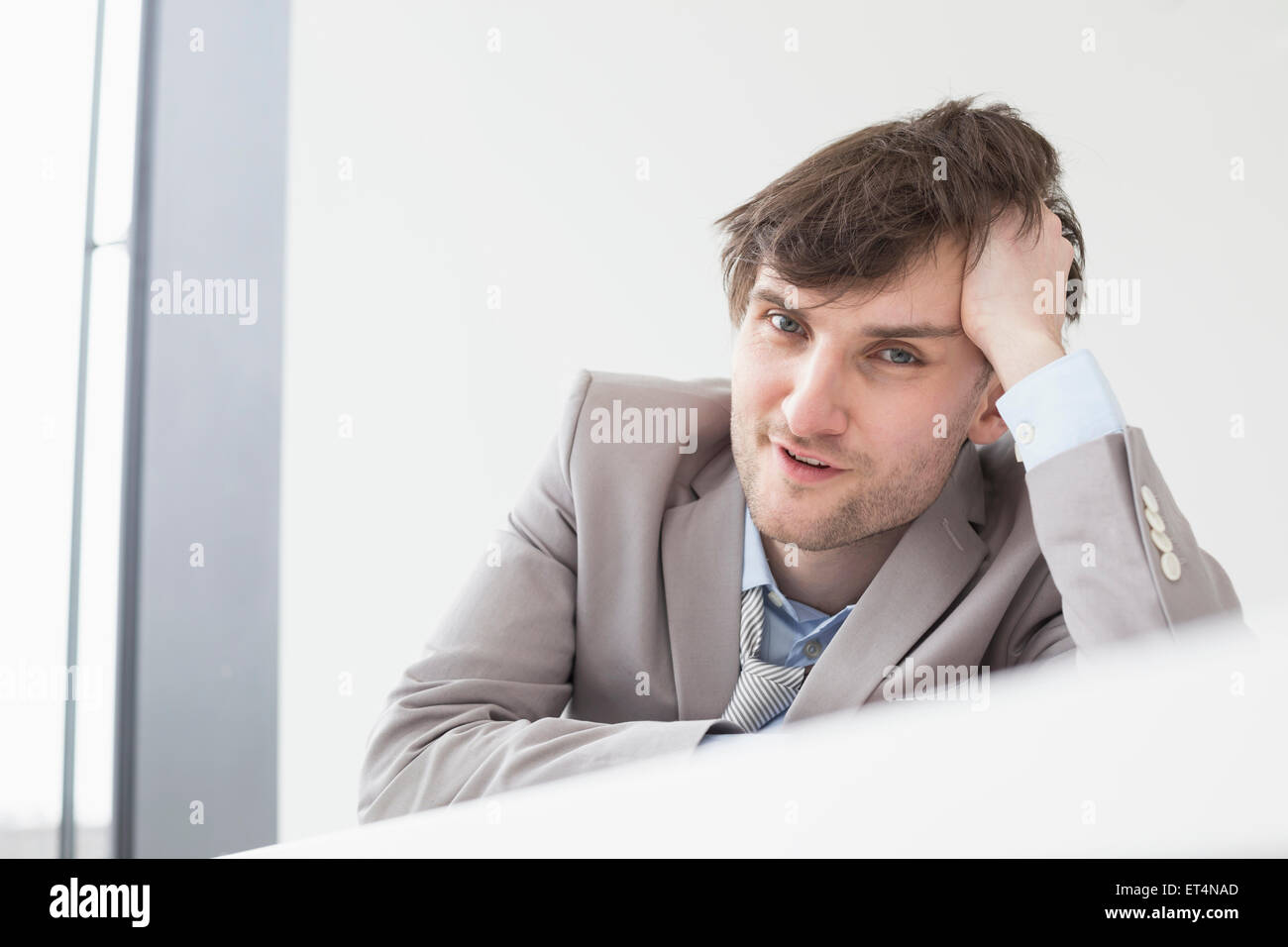 businessman leaning on desk in office, Leipzig, Saxony, Germany Stock ...