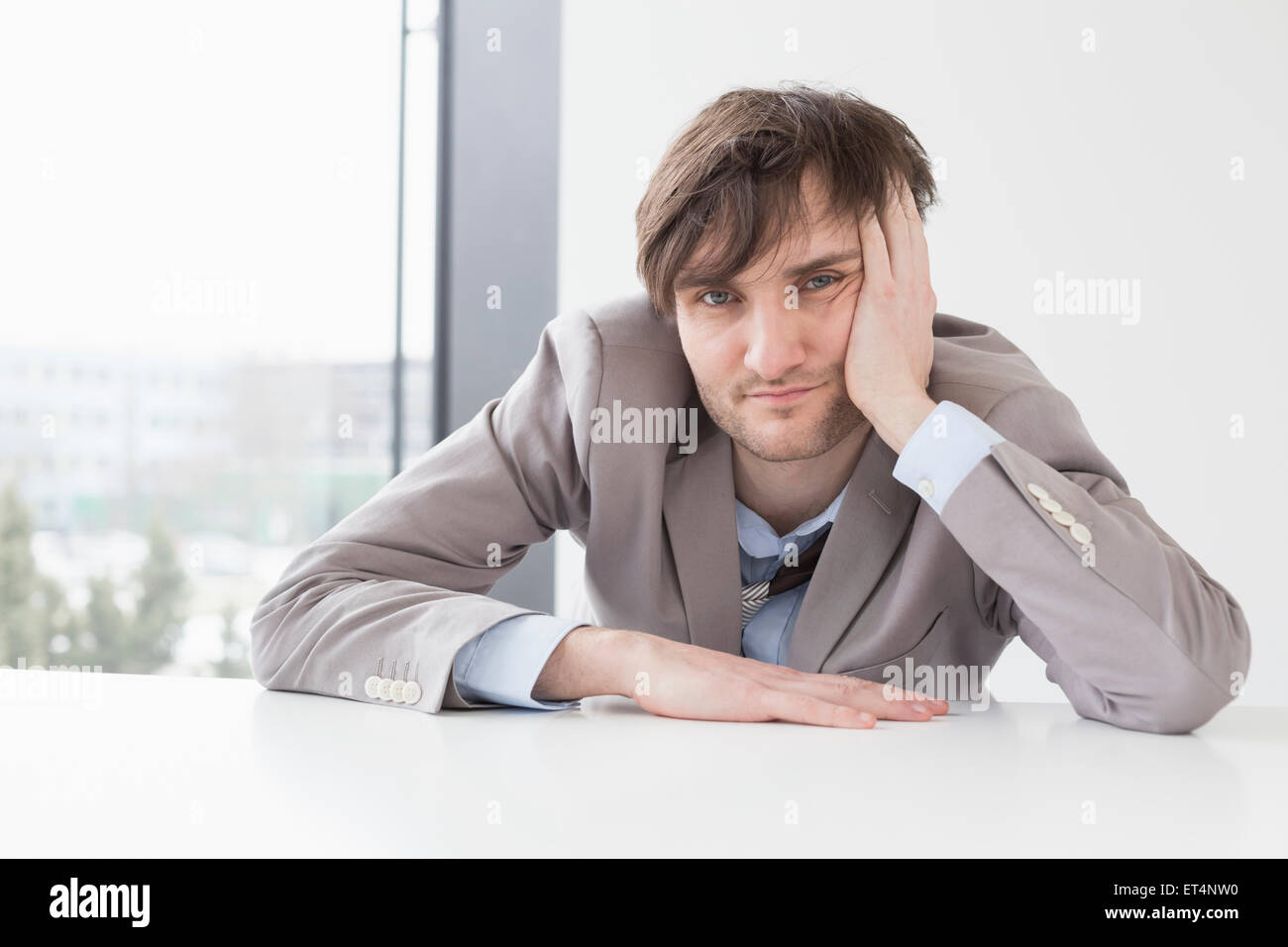 businessman leaning on desk in office, Leipzig, Saxony, Germany Stock ...