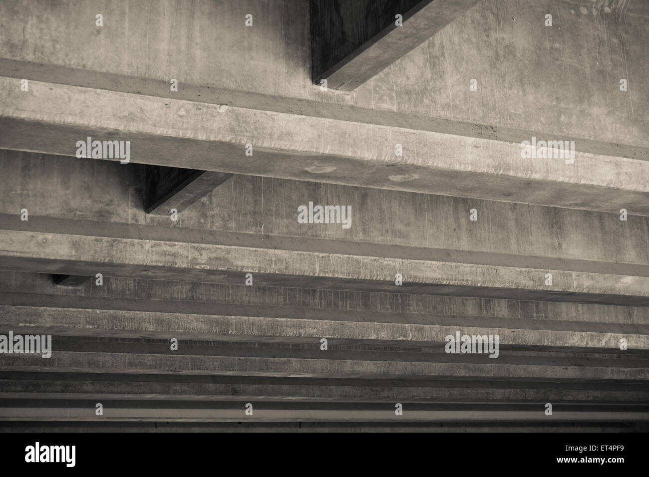 Cement support lines of overpass on highway form abstract background ...