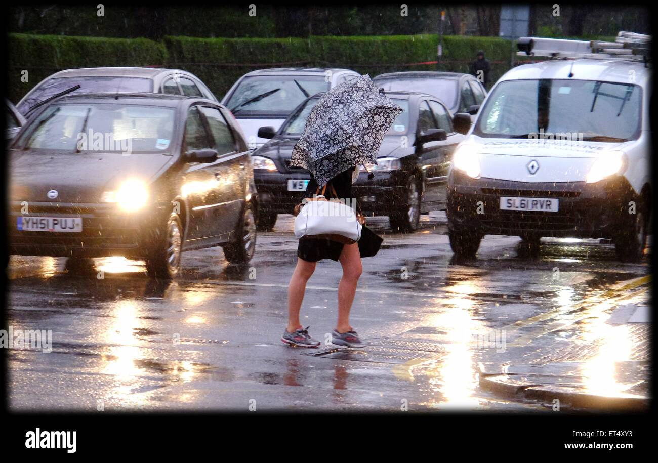 Shoppers brave heavy winds and sleet showers to carry on their ...