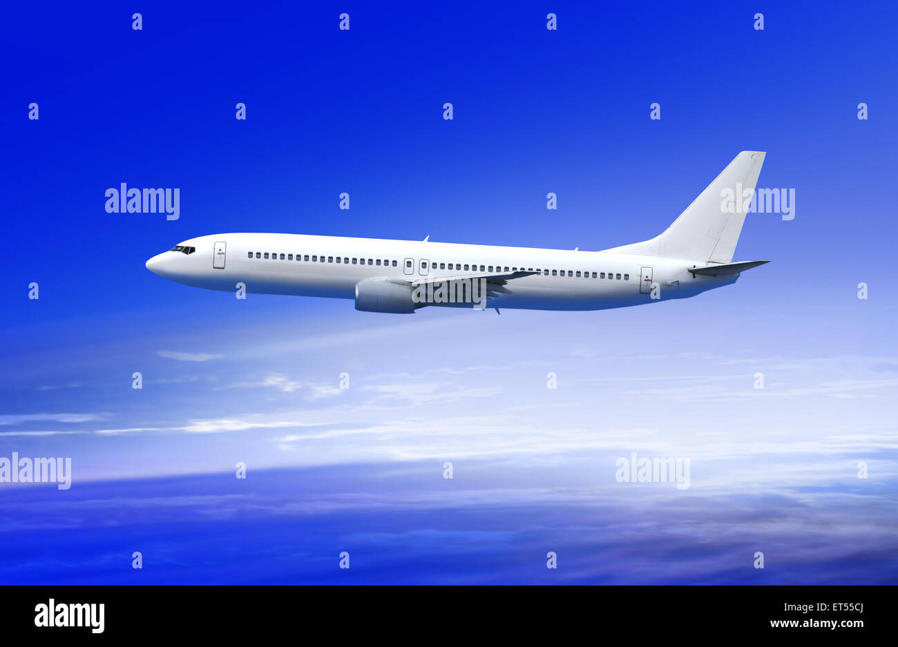 flying white passenger plane in the sky at sunrise Stock Photo - Alamy