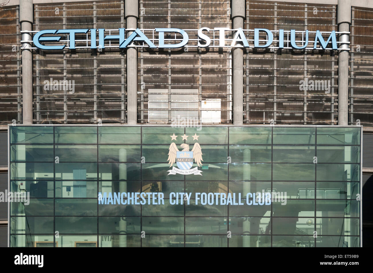 Signs above one of the entrances to the Etihad Stadium, Etihad Campus ...