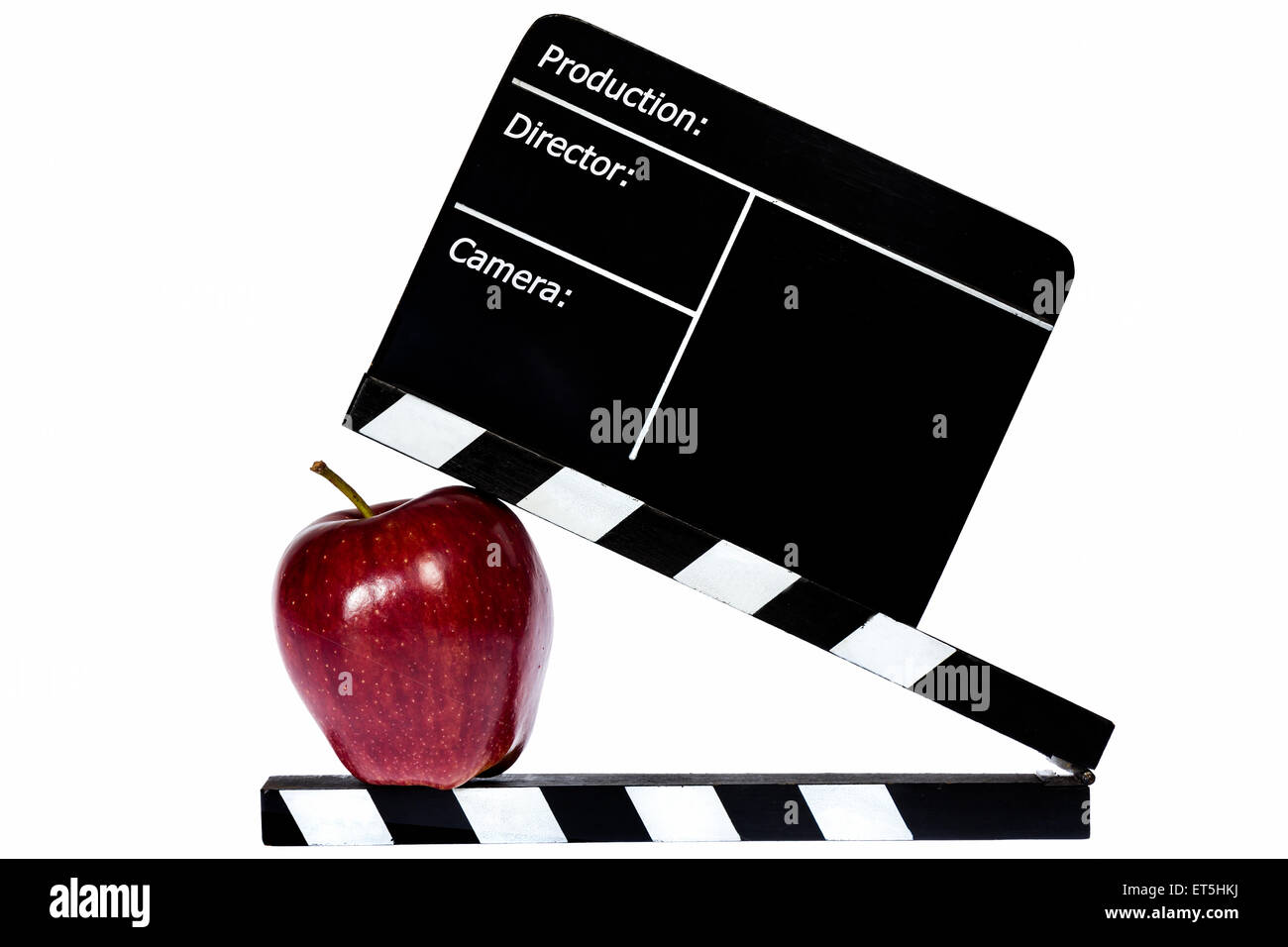 Dark red apple and film flap - white background Stock Photo - Alamy