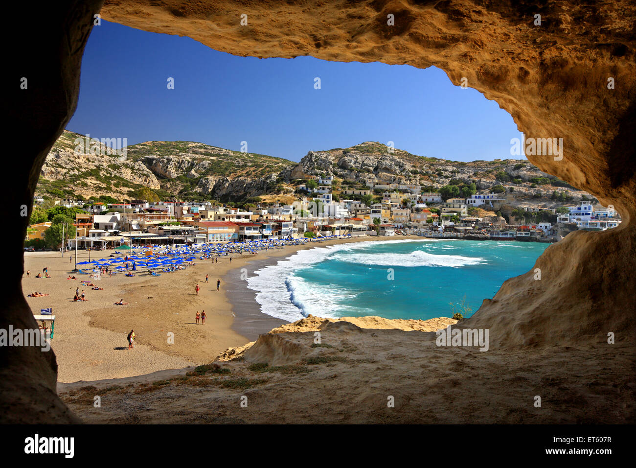 Matala beach with its famous caves, once "home" for many hippies, to ...
