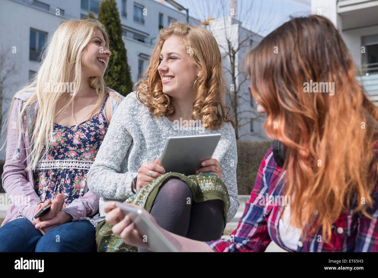 Friends using technology, Munich, Bavaria, Germany Stock Photo - Alamy