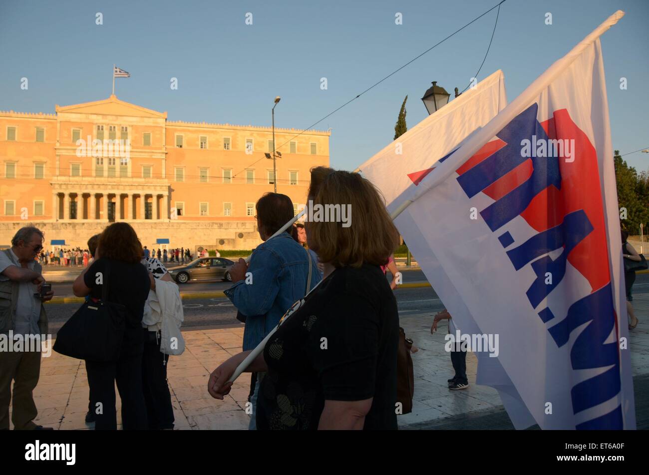 Athens, Greece. 11th June, 2015. Demonstrators holding PAME flags stand ...