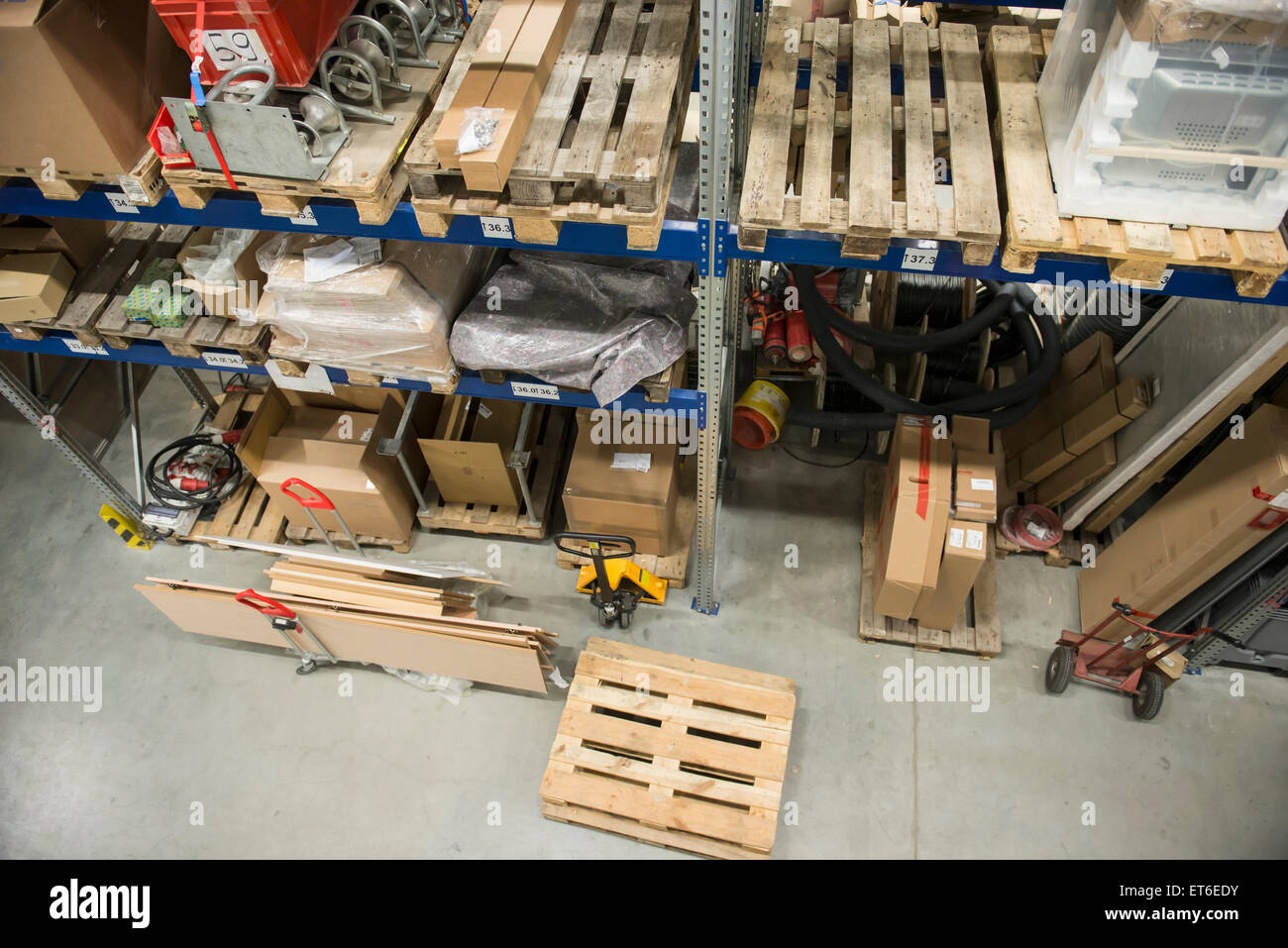 Goods on shelves in warehouse Stock Photo - Alamy