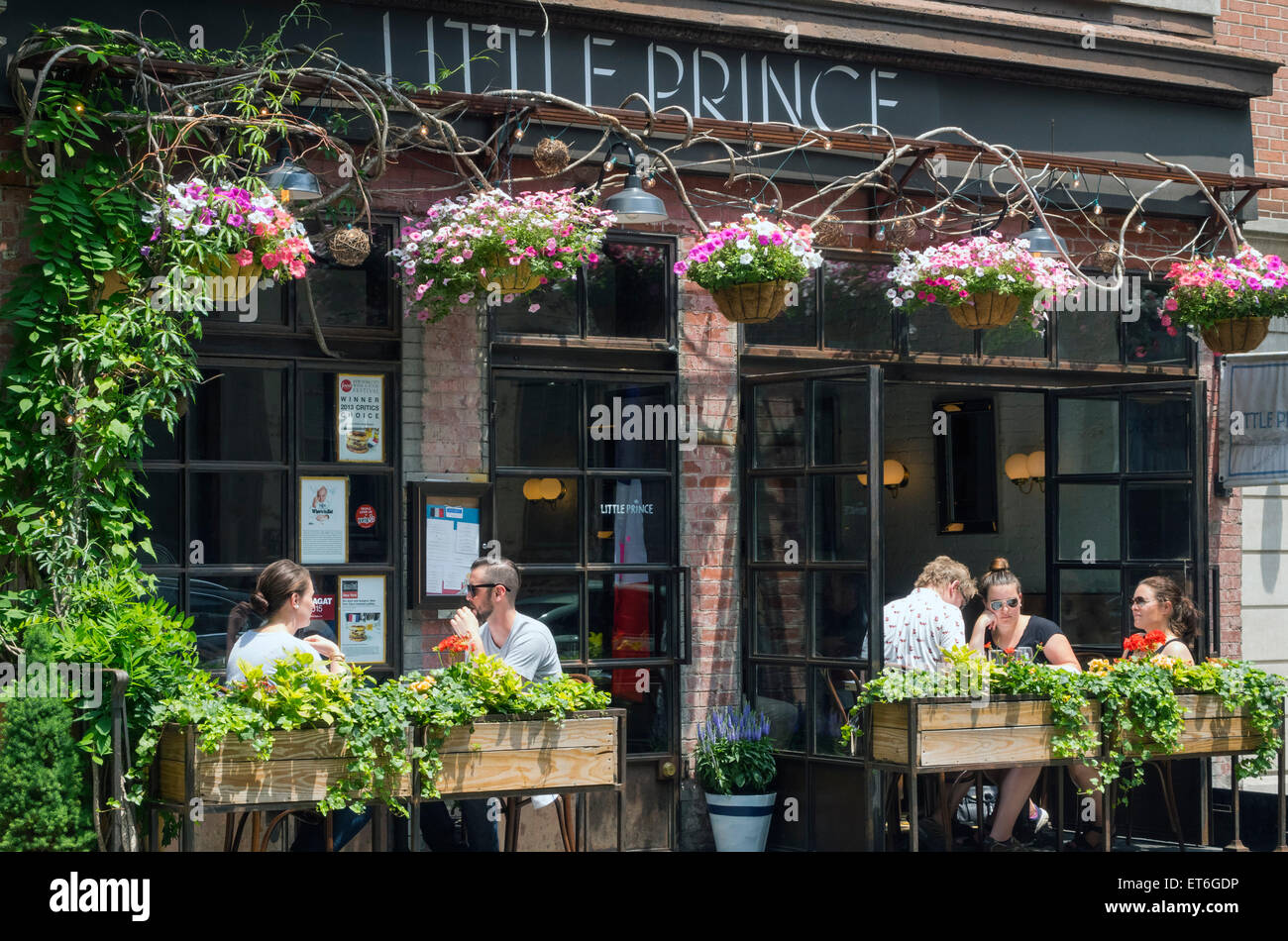 Young people having an alfresco brunch at the Little Prince restaurant ...