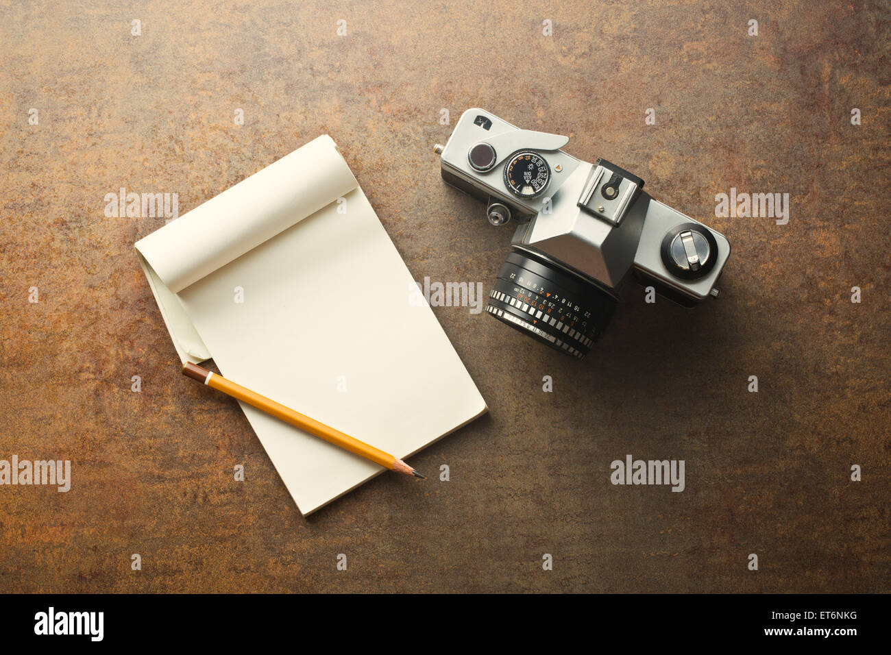 the old analogue camera and notepad Stock Photo - Alamy