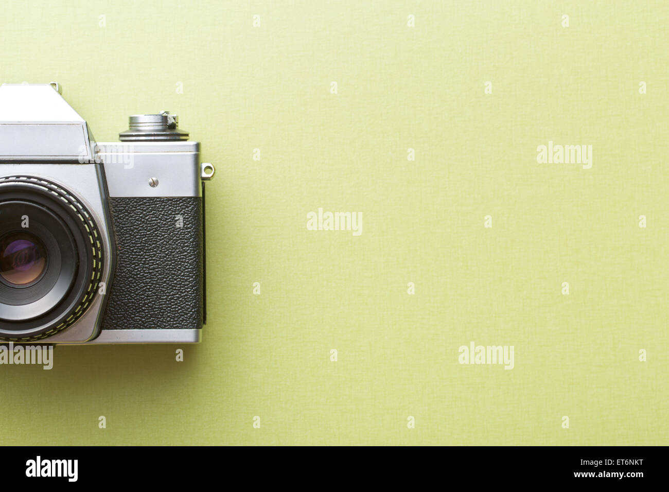 the retro camera on colored background Stock Photo - Alamy
