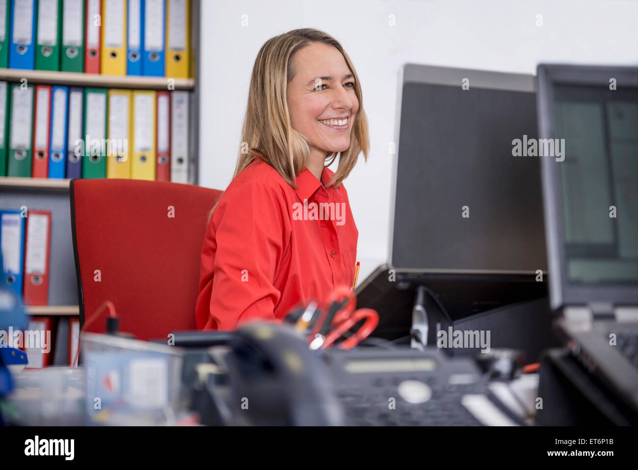 Blonde woman filing hi-res stock photography and images - Alamy