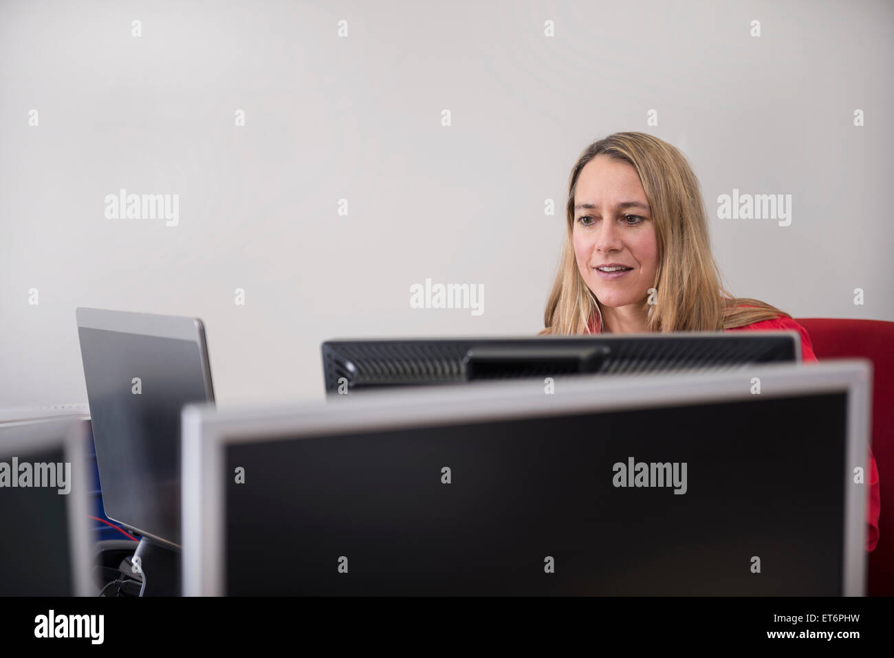 Woman working in office, Munich, Bavaria, Germany Stock Photo - Alamy