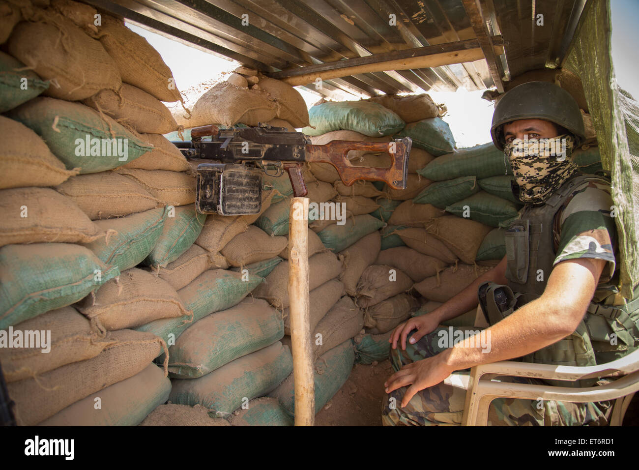 Peshmerga fighters stand ready at the Al Rash front line against ISIS ...