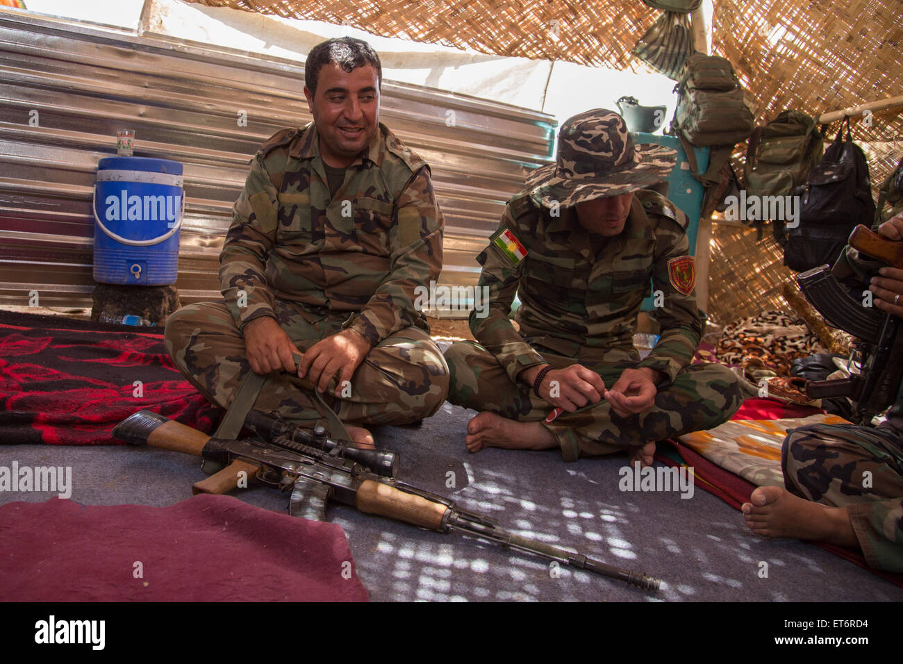 Peshmerga fighters stand ready at the Al Rash front line against ISIS ...