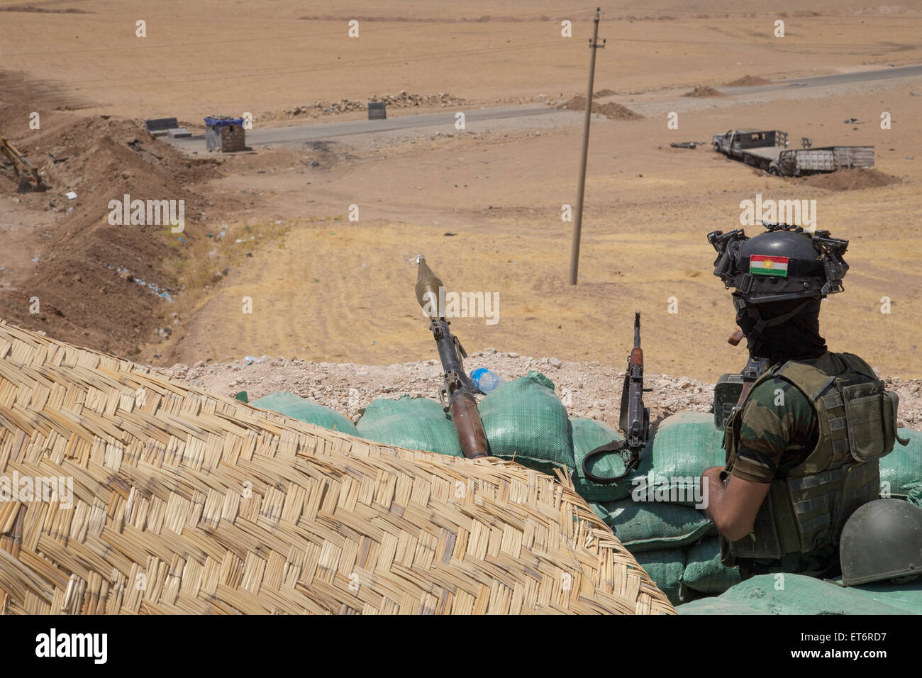 Peshmerga fighters stand ready at the Al Rash front line against ISIS ...
