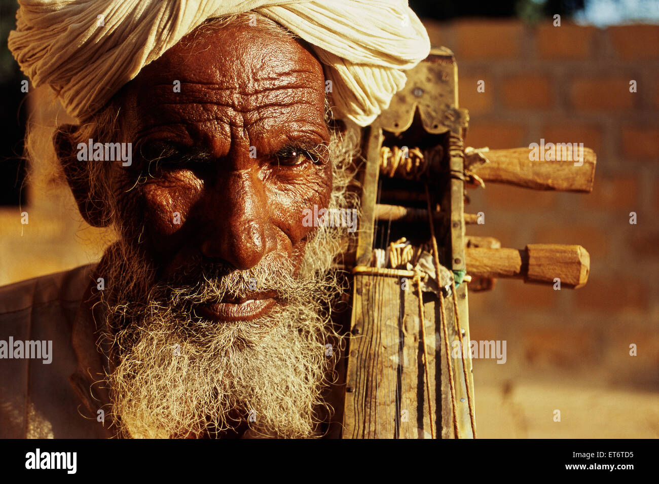 Muslim musician playing a traditional musical instrument ( India Stock ...