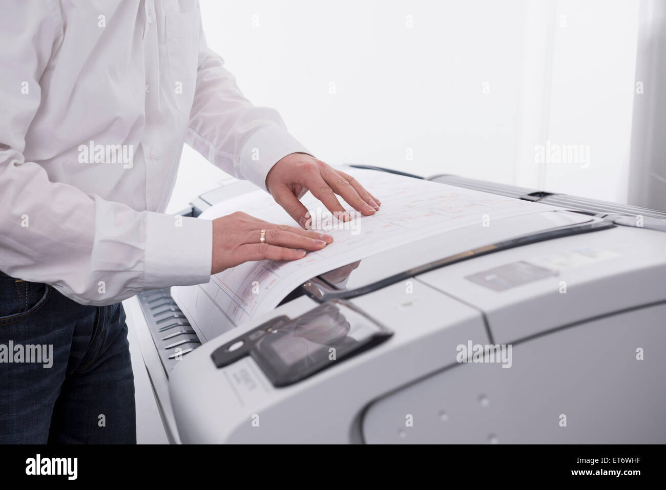 Man using photocopier in office, Munich, Bavaria, Germany Stock Photo ...