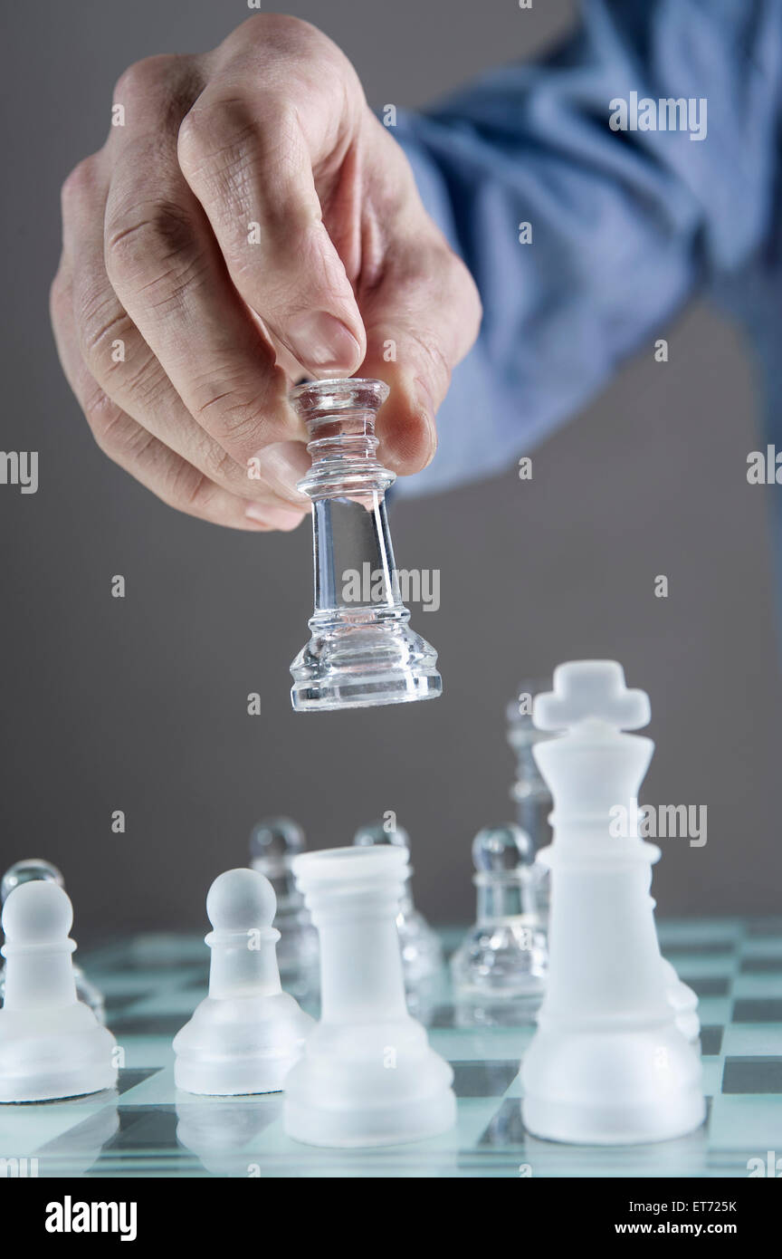 Close-up of man's hand going for checkmate while playing chess, Bavaria ...