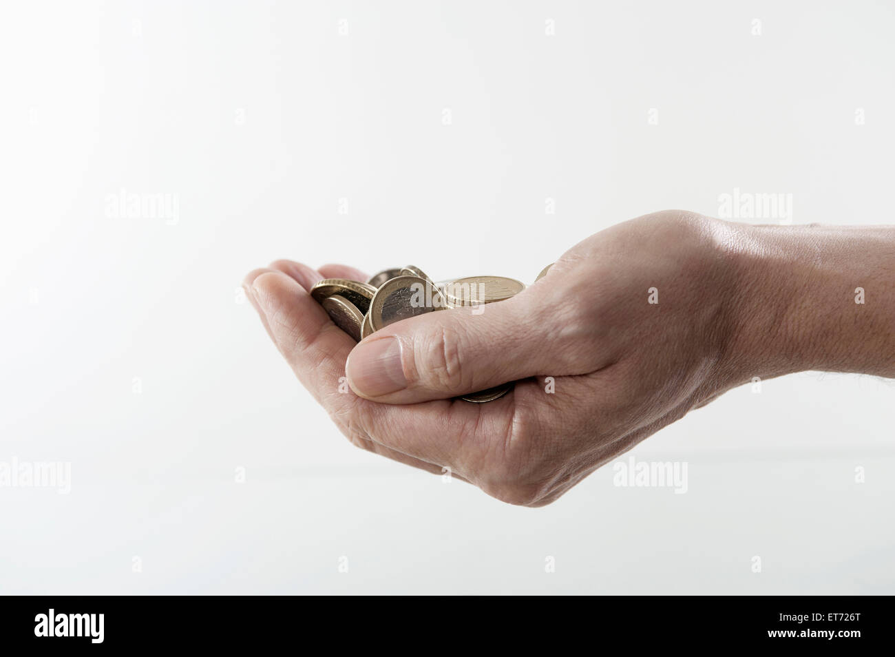 businessman's hand with handful of coins, Bavaria, Germany Stock Photo ...