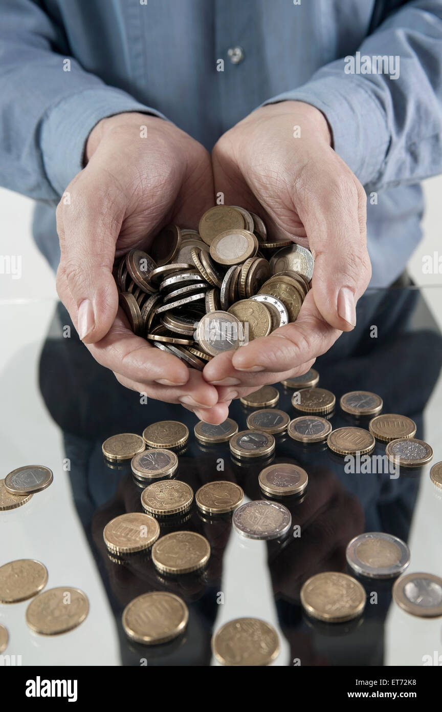 Hands paying coins hi-res stock photography and images - Alamy