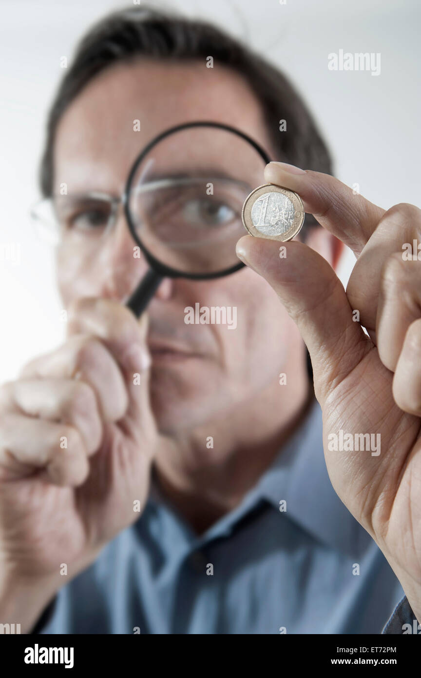 Magnifying glass examining hi-res stock photography and images - Alamy