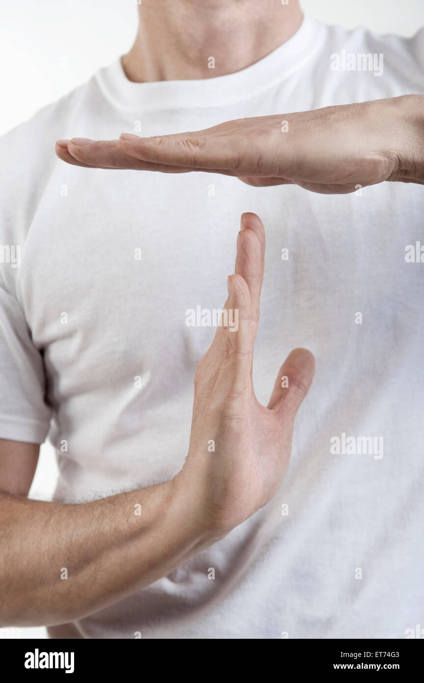 Man showing time out gesture with hands, Bavaria, Germany Stock Photo ...