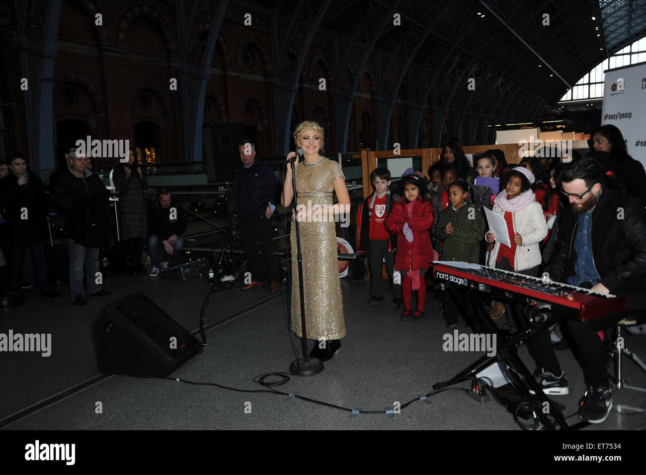 Pixie Lott sings with childrens choir at St Pancras station in aid of ...